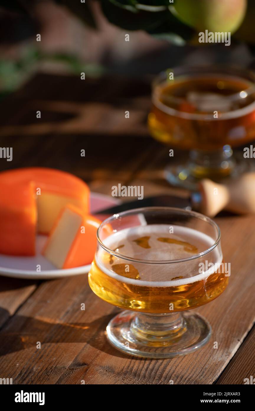 Food and drink pairing, apple cider in glasses produced on organic farm ...