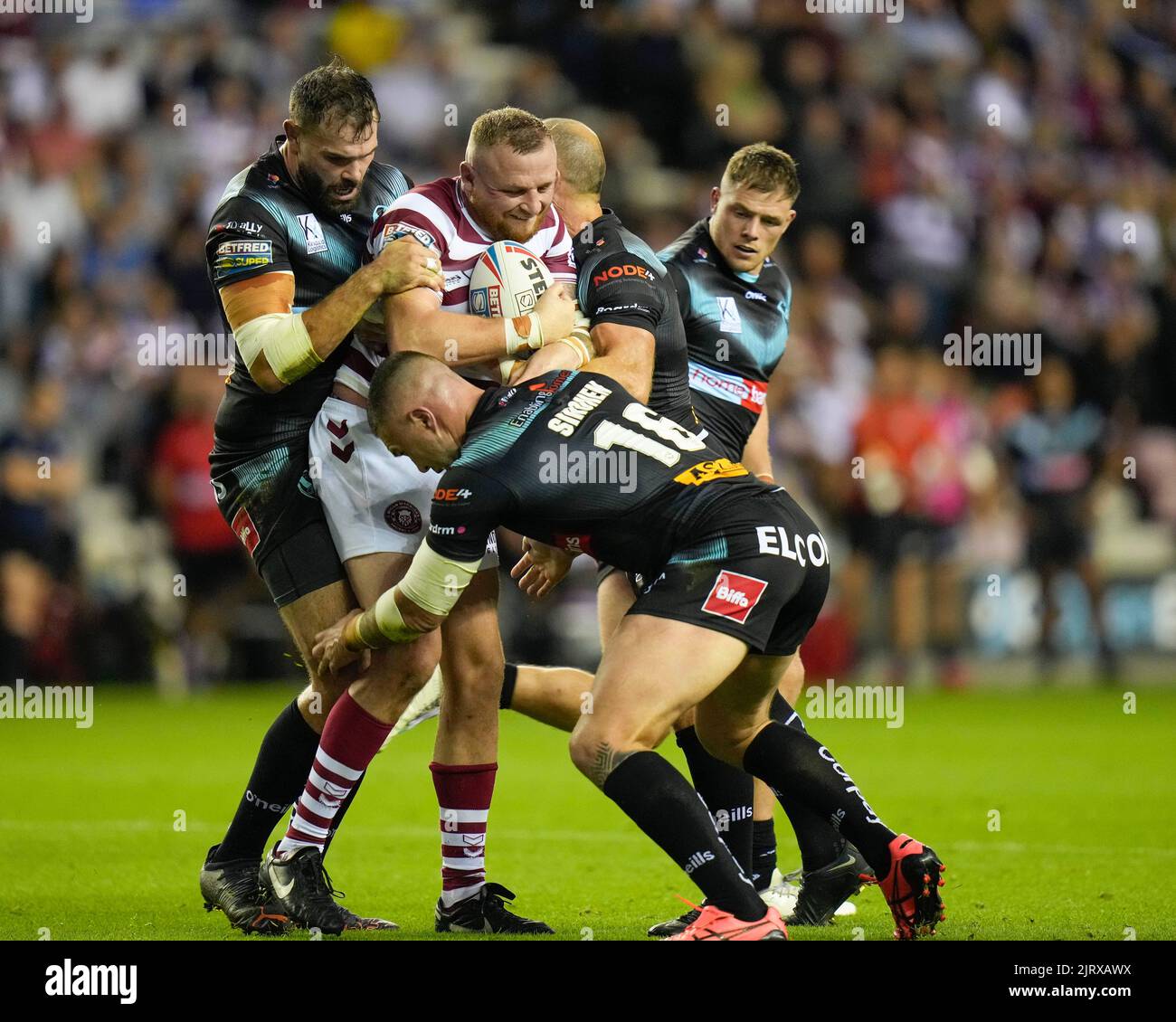 Curtis Sironen #16 and Alex Walmsley of St Helens tackle Brad Singleton ...