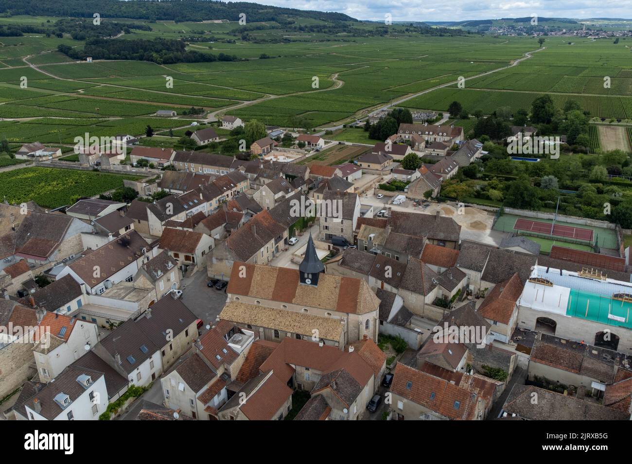 Aerial view on green vineyards and Puligny-Montrachet village ...