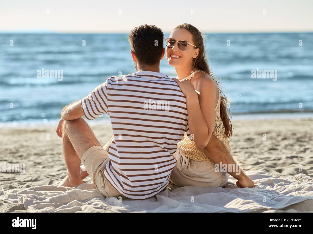 happy couple hugging on summer beach Stock Photo - Alamy