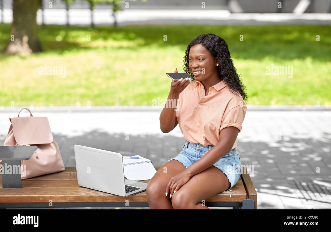 african student girl recording voice on smartphone Stock Photo - Alamy