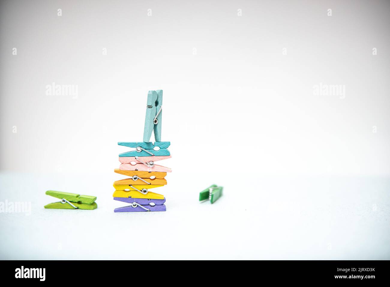 multi-colored clothespins for laundry on a white background Stock Photo ...