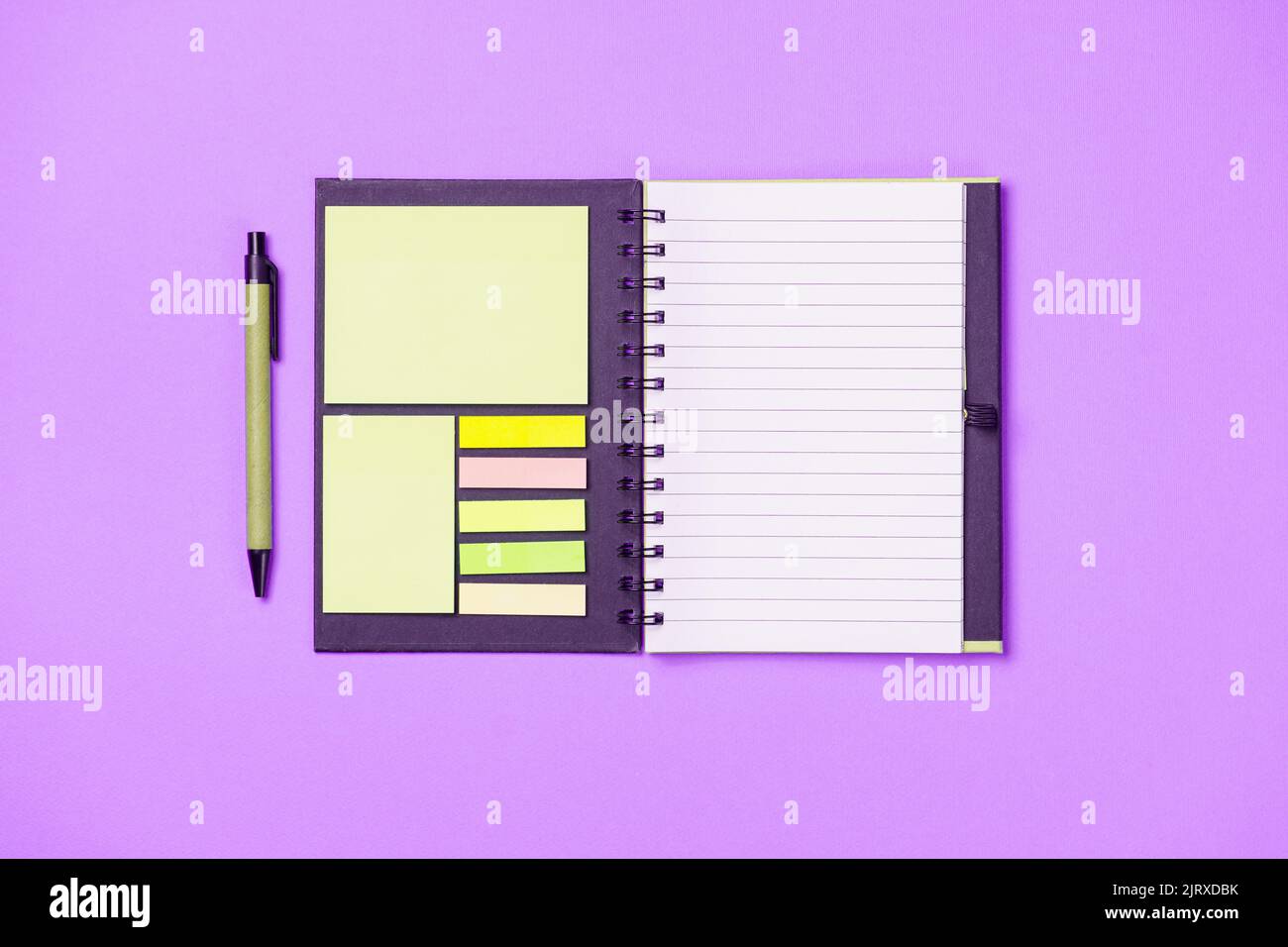 School notebook on a paper pink background, spiral notepad and craft ...