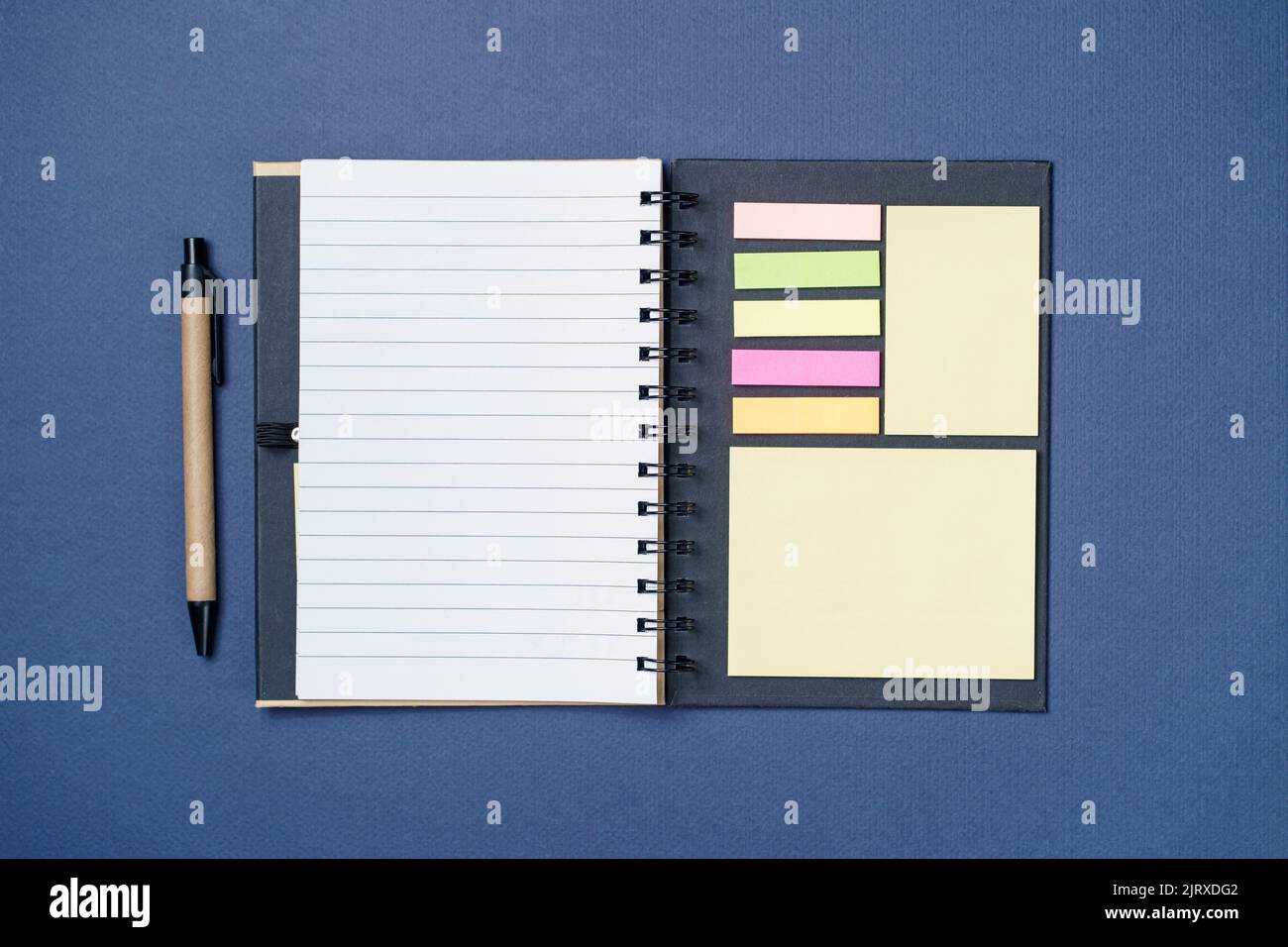 School notebook on a paper blue background, spiral notepad and craft ...