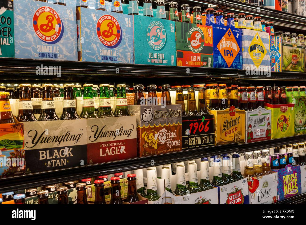 A selection of six-packs of beer in a grocery store in New York on ...
