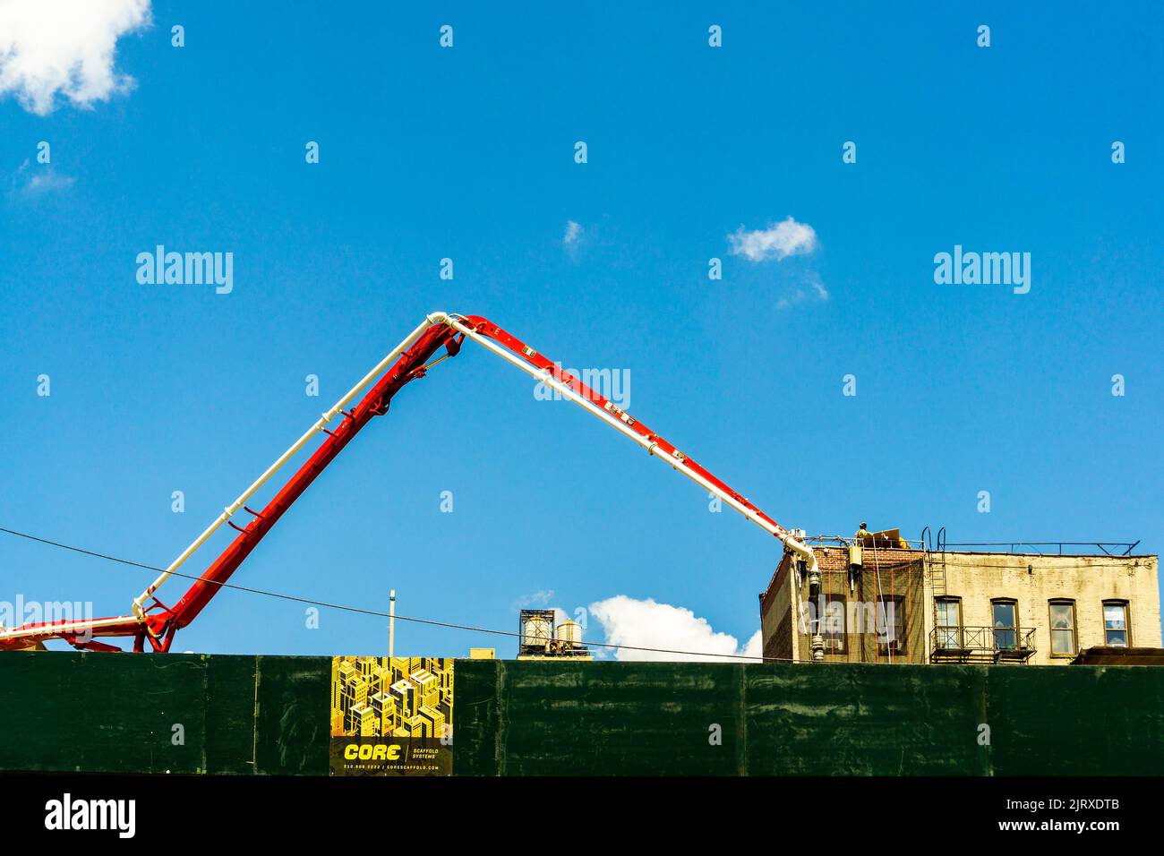 Concrete pumping at the construction of senior affordable housing ...