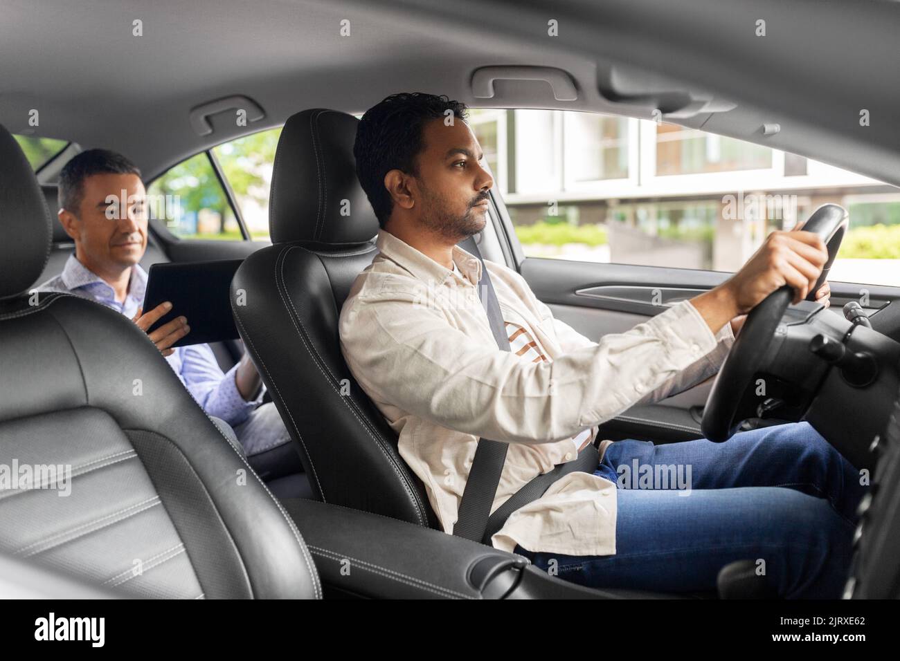 indian male driver driving car with passenger Stock Photo - Alamy