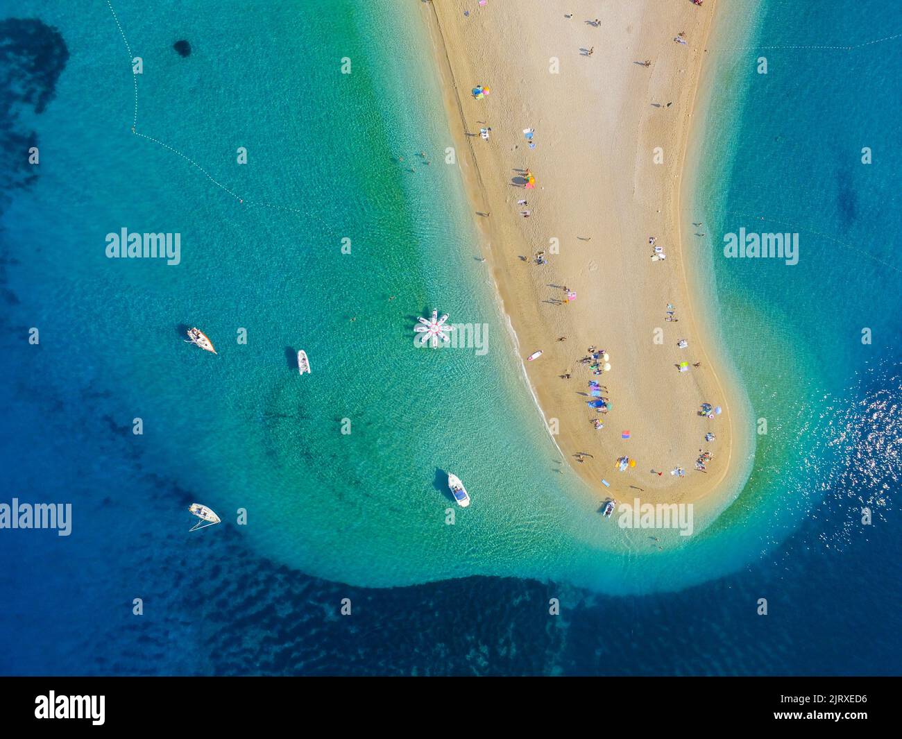 A beautiful aerial view of the Zlatni Rat Golden Horn Beach in Croatia ...