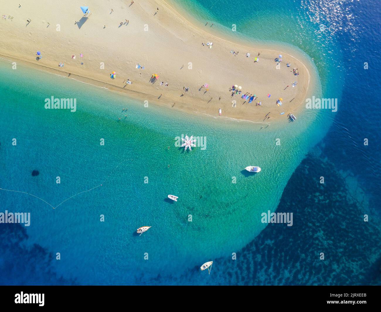A beautiful aerial view of the Zlatni Rat Golden Horn Beach in Croatia ...