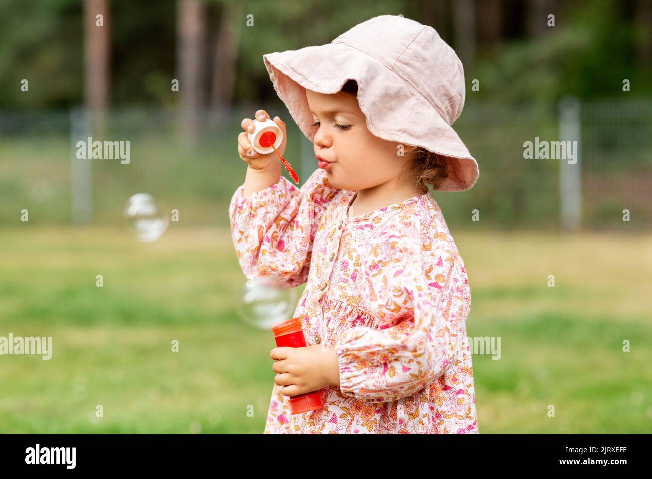 Happy child toddler girl bubbles outdoors hi-res stock photography and ...