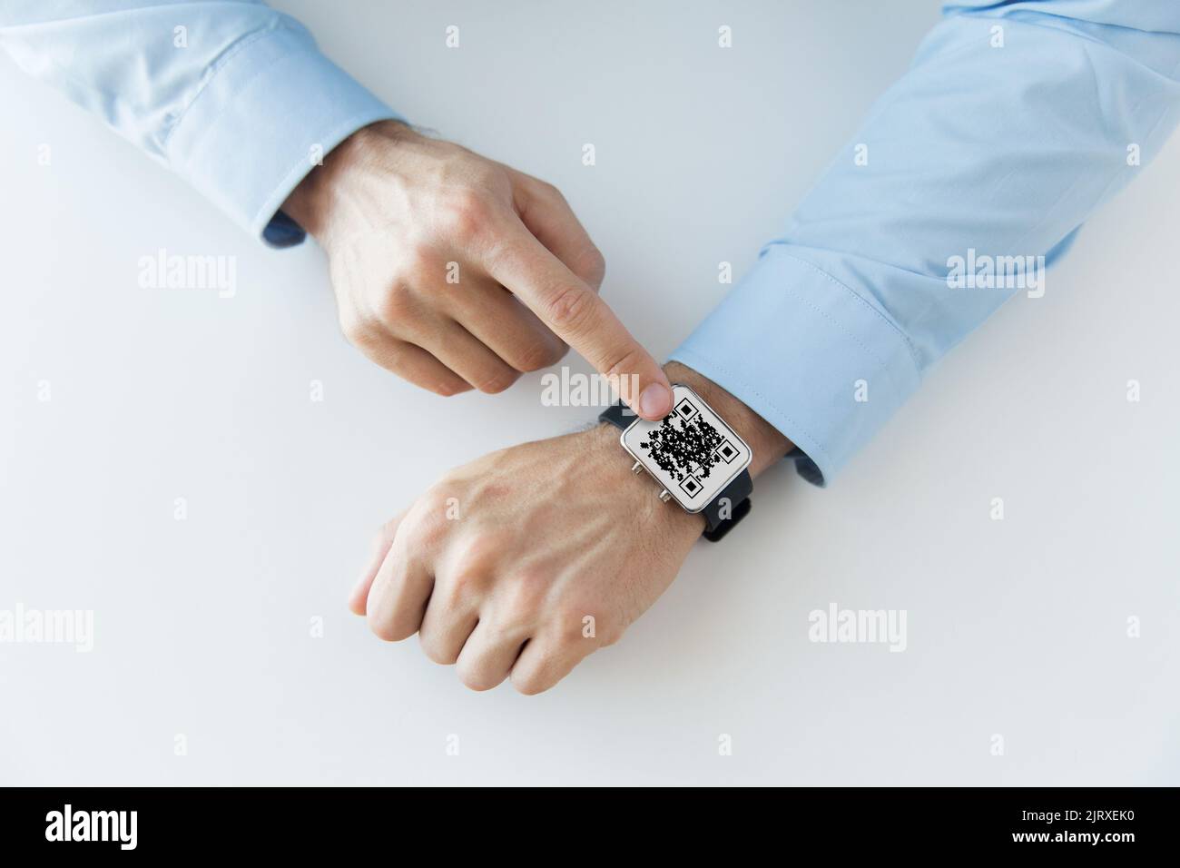 man's hands with qr code on smart watch Stock Photo - Alamy
