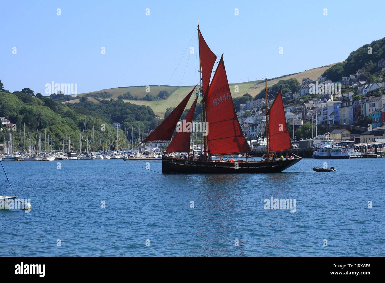 Brixham Trawler sailing in Dartmouth along the estuary. Devon Stock ...