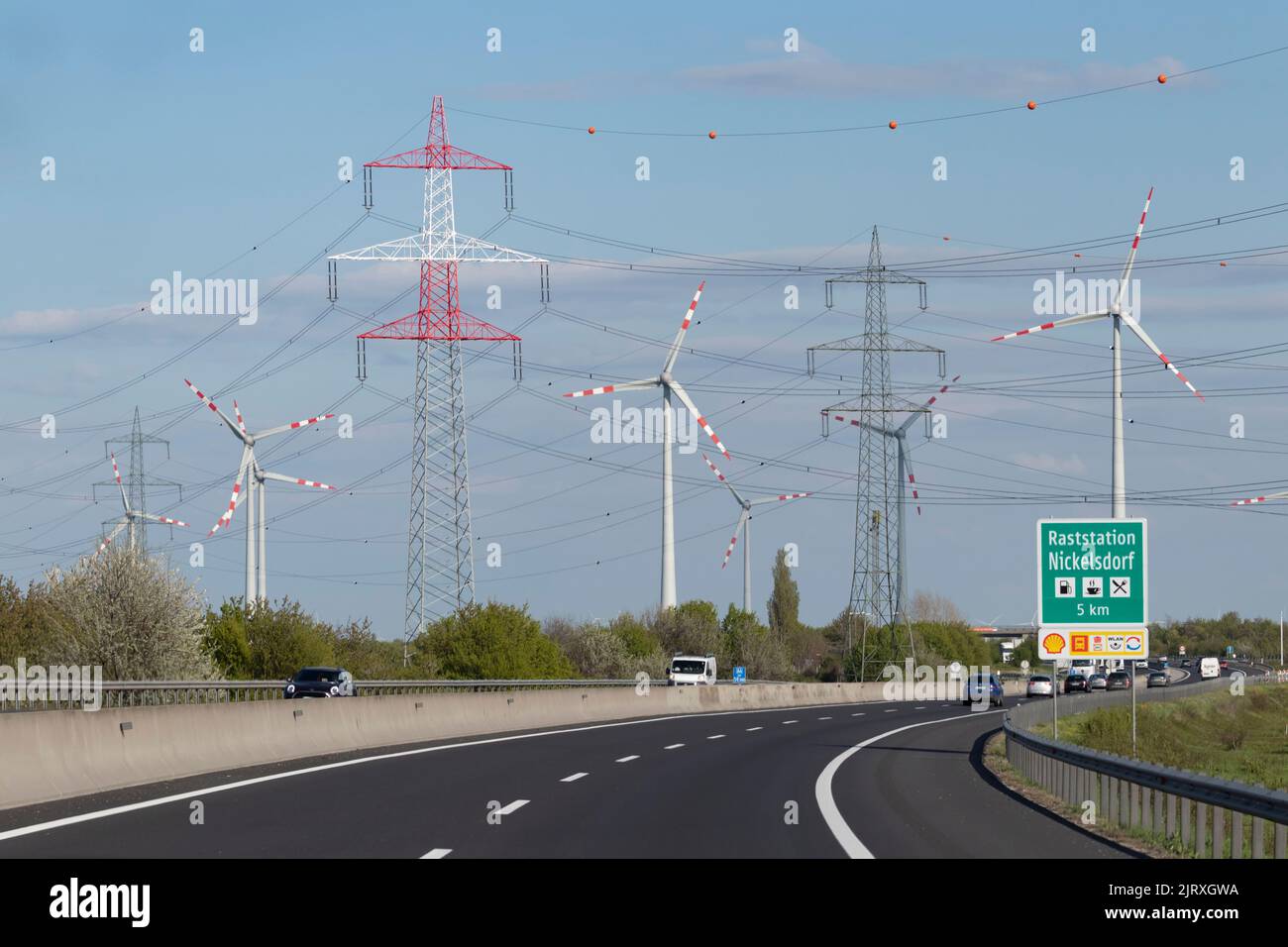 Wind power "wind farm" turbines and electrical power lines next to Ost ...