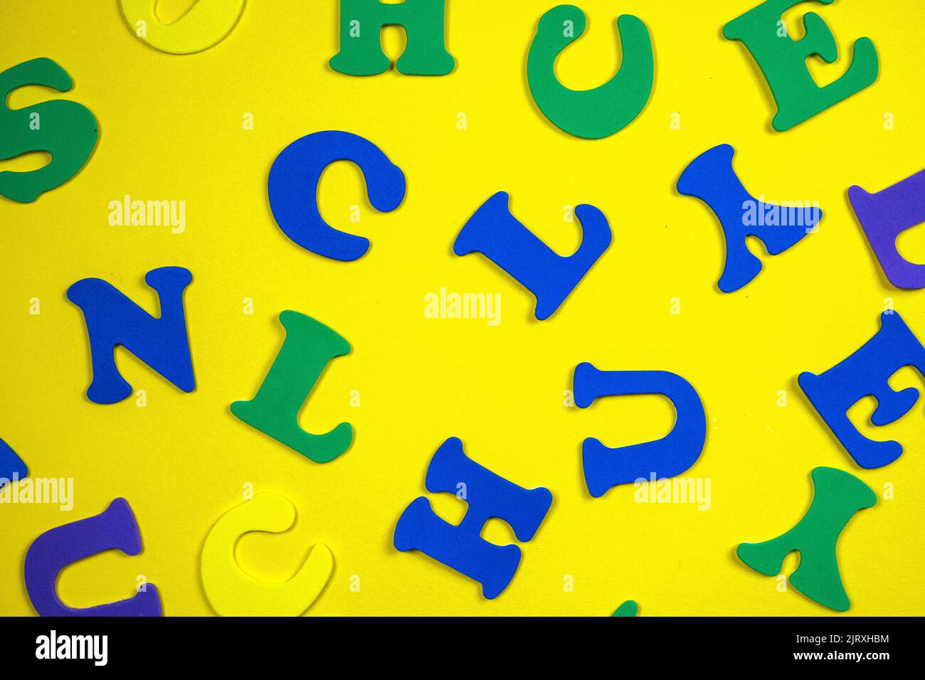 Colorful letters of the alphabet on yellow background.. Educational ...