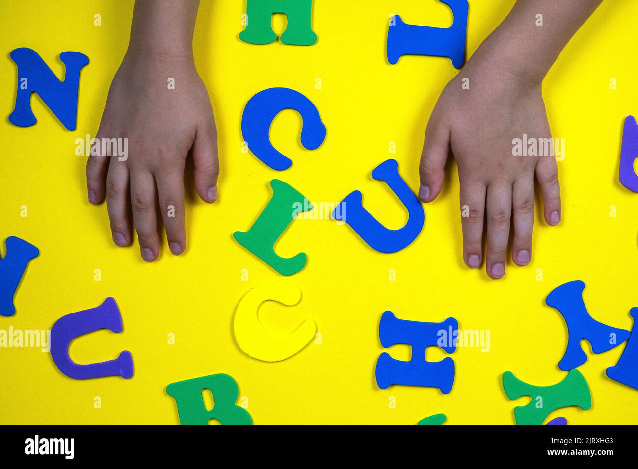 Colorful letters of the alphabet on yellow background.. Educational ...