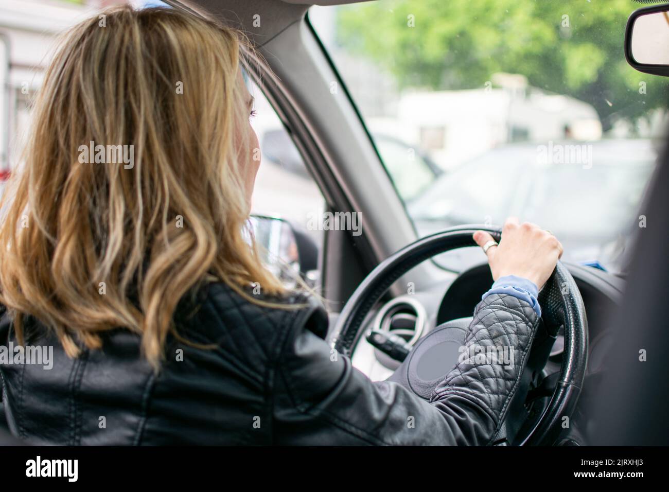 Young blonde woman Driving a Car Stock Photo - Alamy