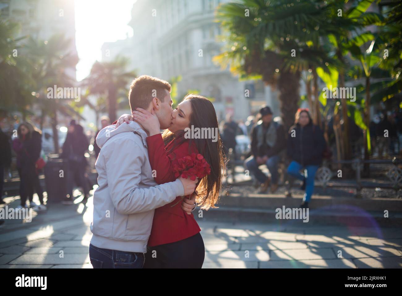 Young couple kissing outdoors hi-res stock photography and images - Alamy