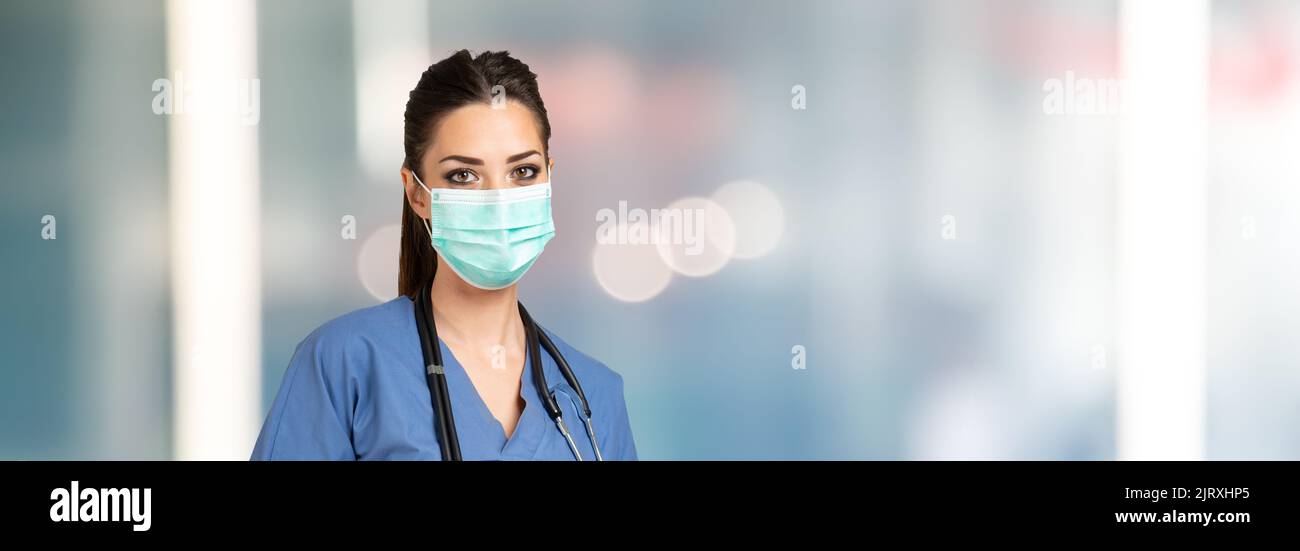 Young masked female nurse portrait, covid coronavirus mask. Wide ...