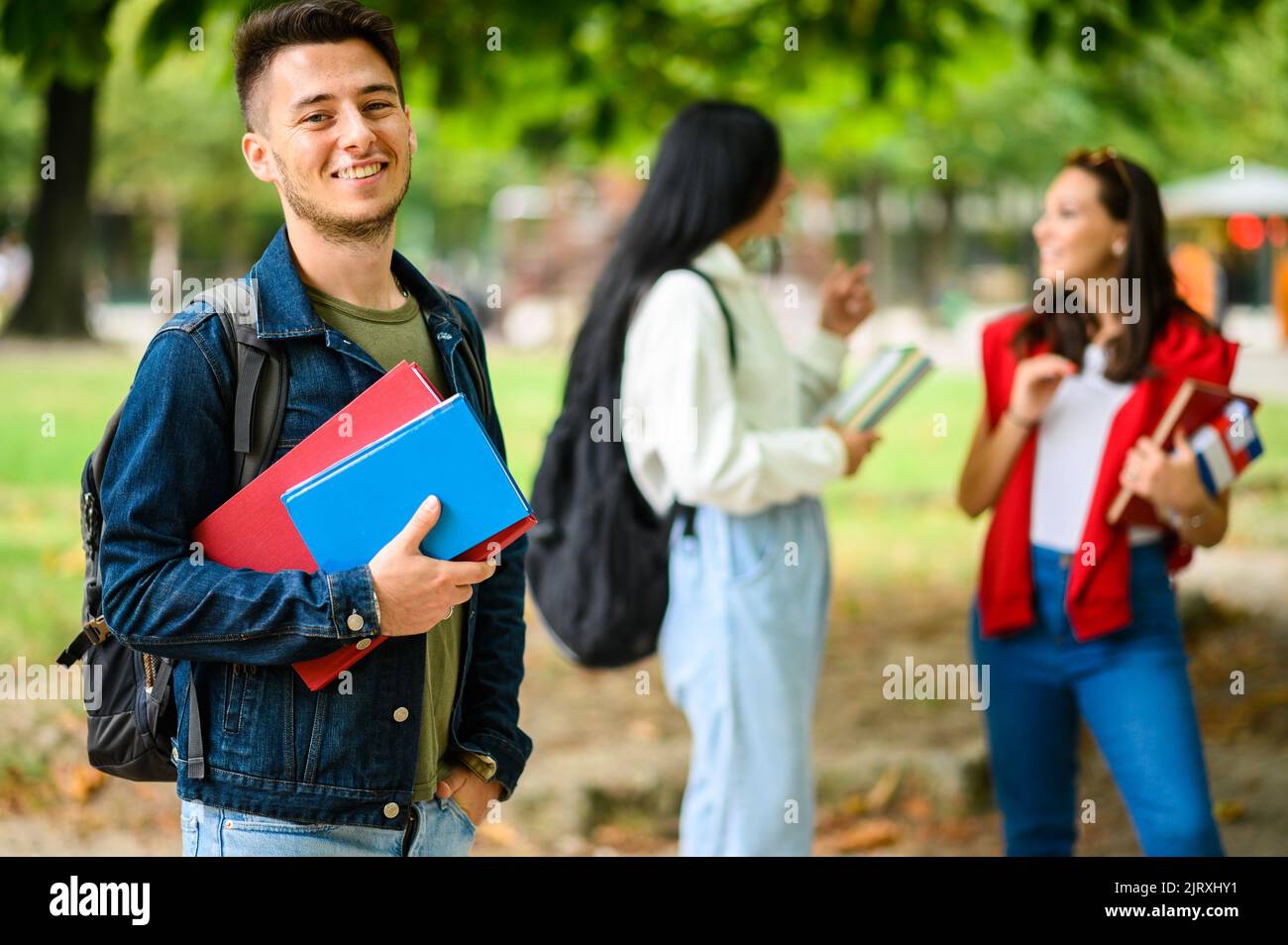 Happy male student outdoor smiling Stock Photo - Alamy