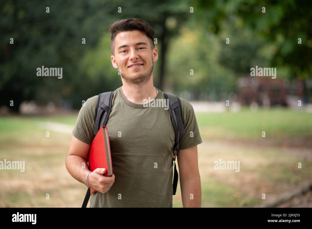 Happy male student outdoor smiling Stock Photo - Alamy