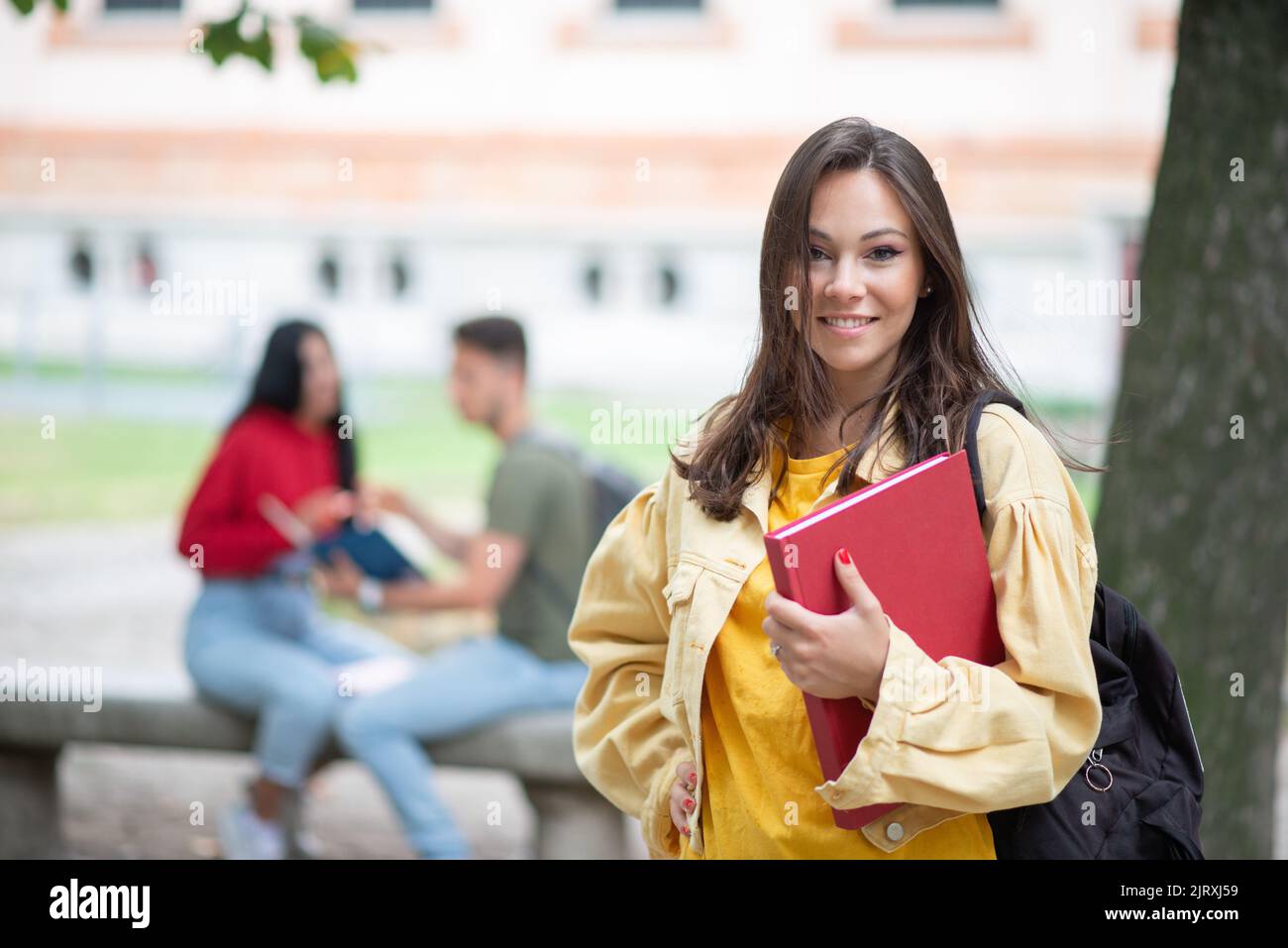 Young woman book graduation hi-res stock photography and images - Alamy