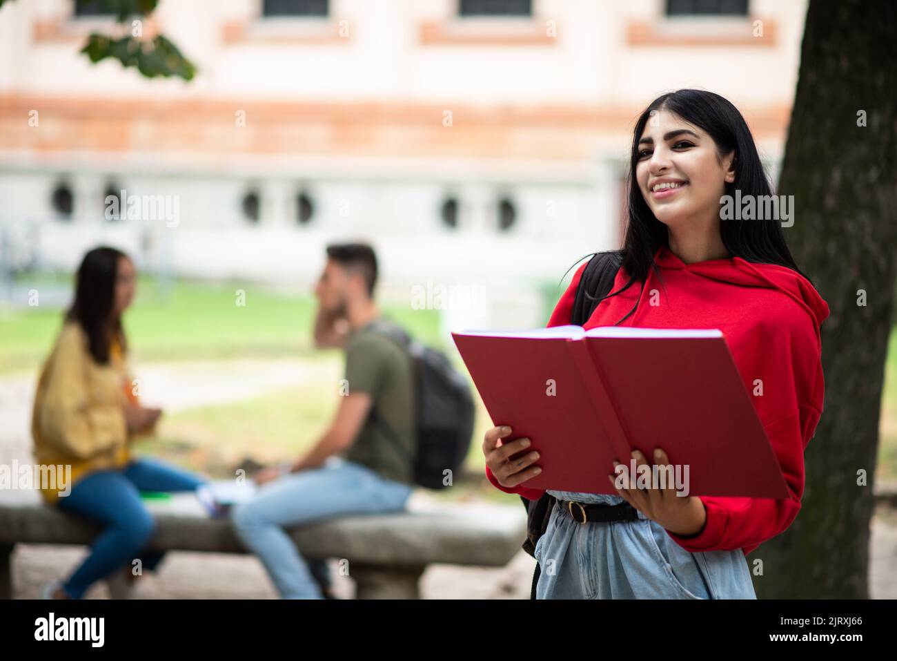Group reading book outdoor hi-res stock photography and images - Alamy