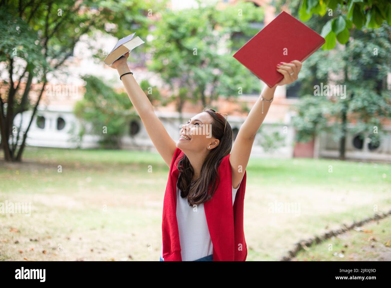 Female university student raising hand hi-res stock photography and ...