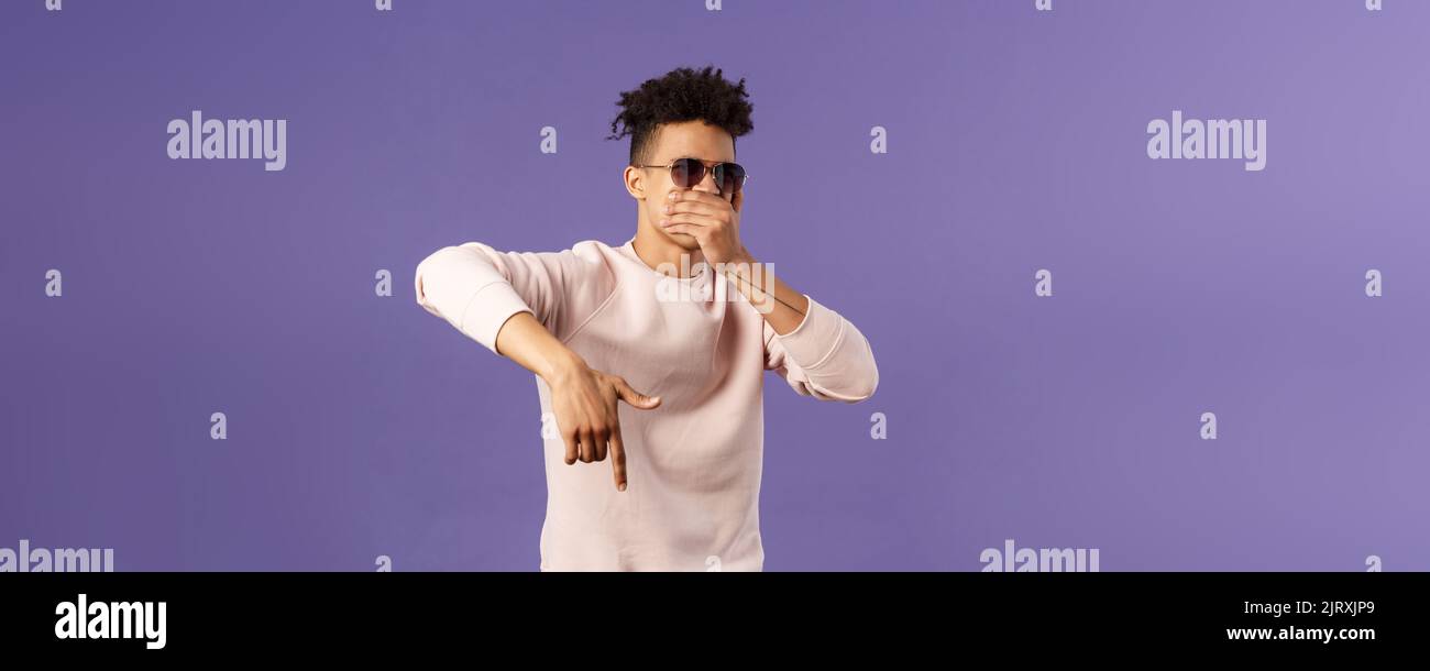 Waist-up portrait of cool young handsome guy with dreads, sunglasses on ...