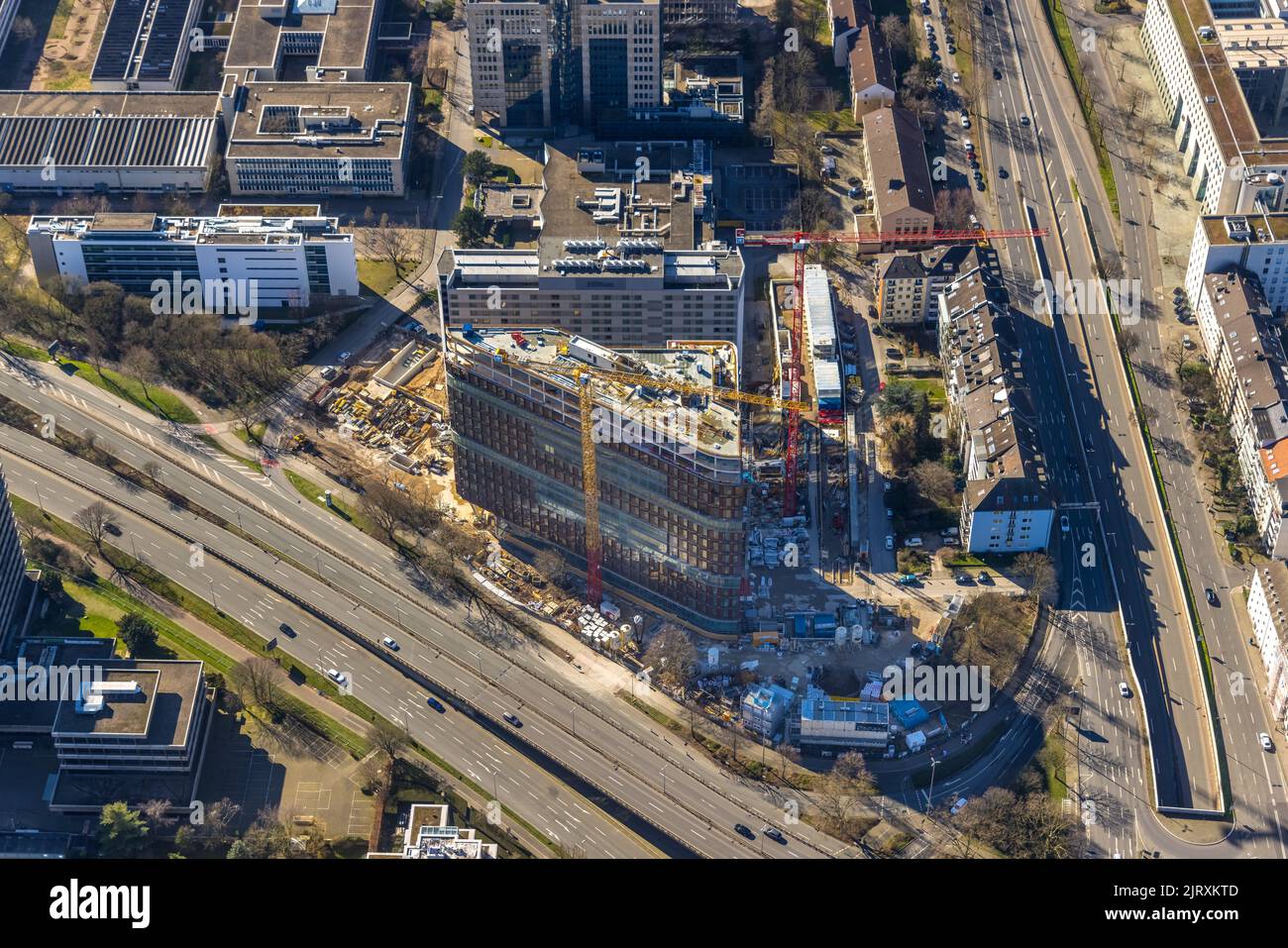 Aerial view, construction site and new building triangular office tower ...