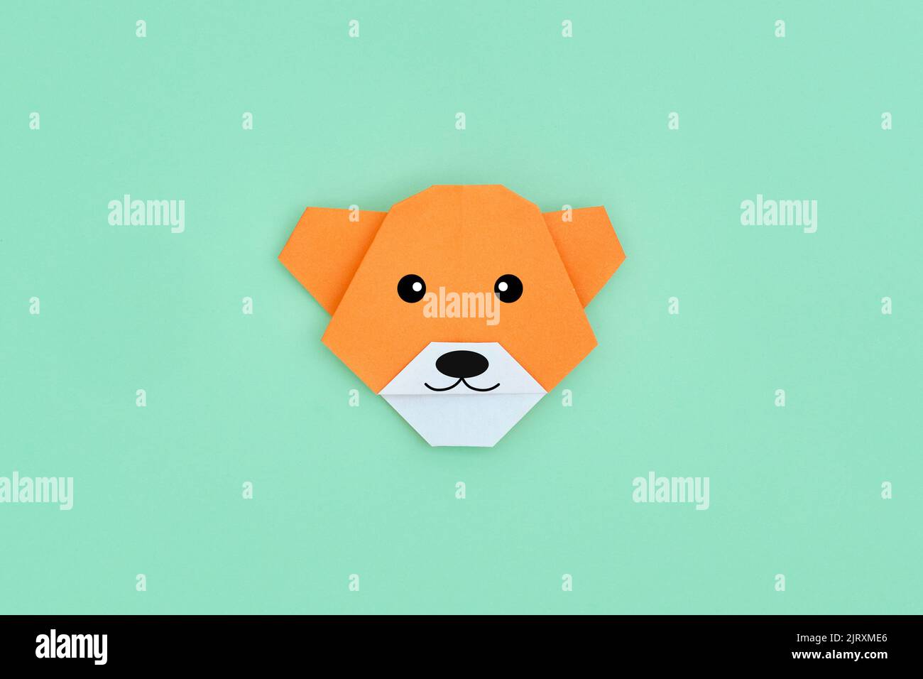 Origami Bear. Step-by-step photo instruction on a green background. DIY ...