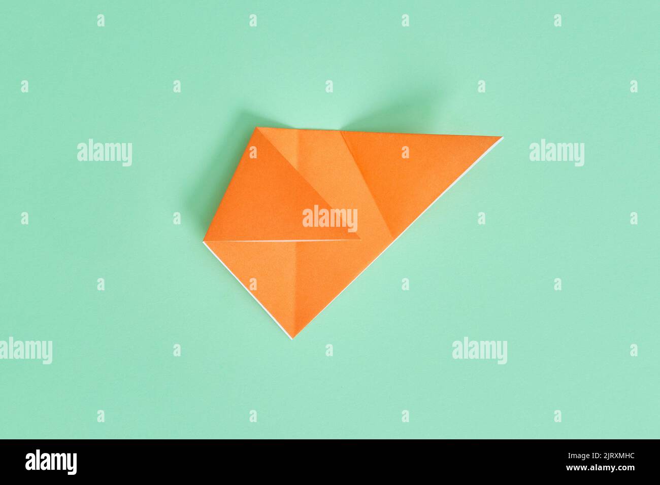 Origami Bear. Step-by-step photo instruction on a green background. DIY ...