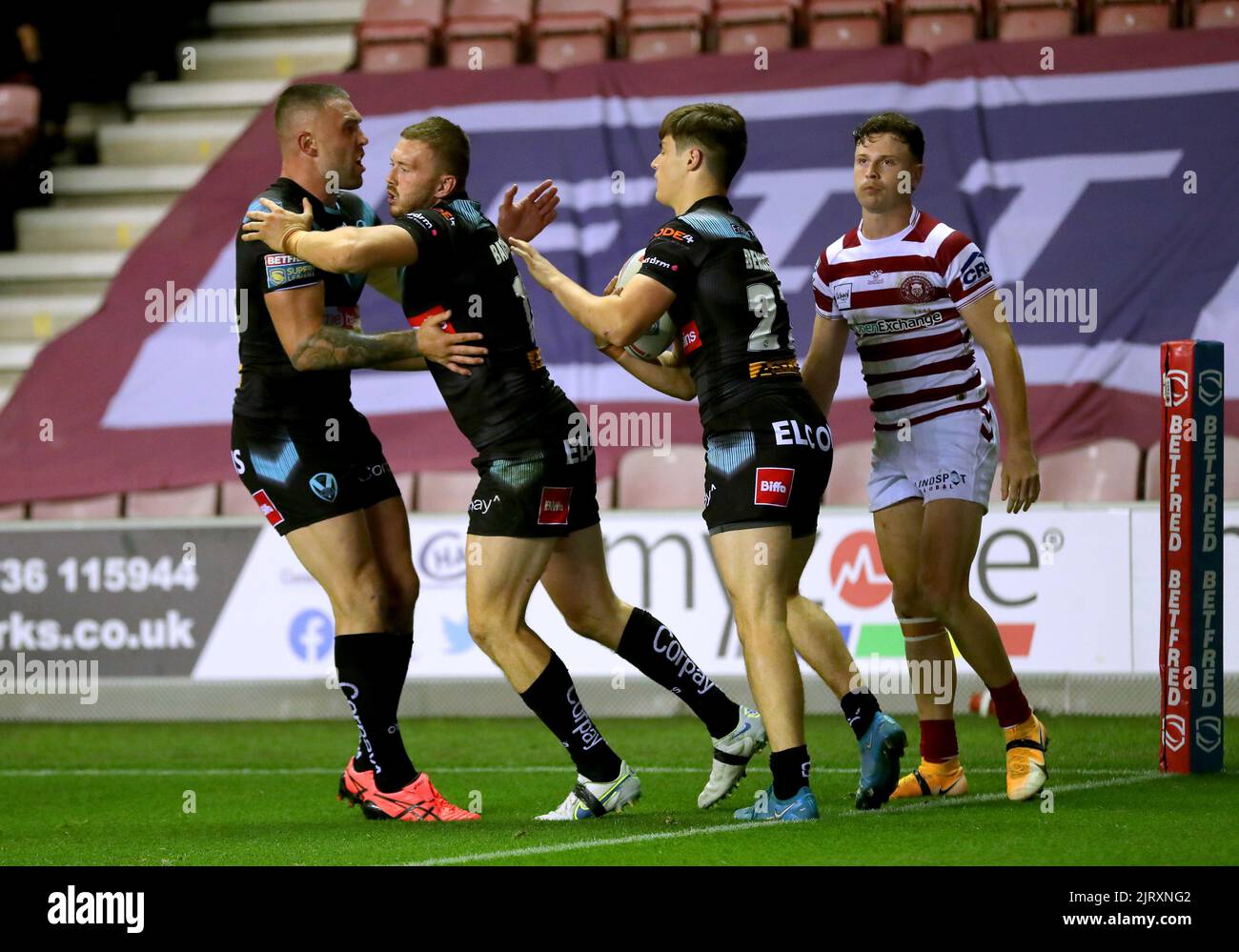 St Helens' Joe Batchelor celebrates with his team-mates after scoring a ...