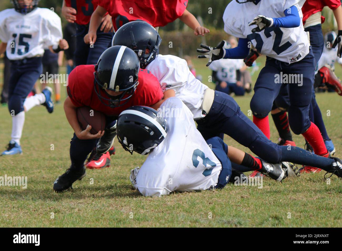 Kids playing football head hi-res stock photography and images - Alamy