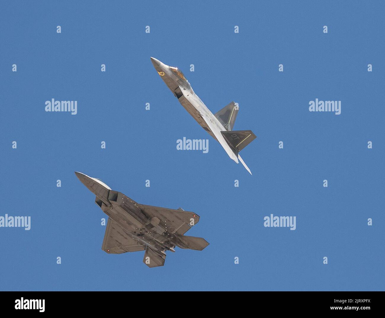 Two F-22 Raptors fly over Edwards Air Force Base, California, Aug. 23 ...