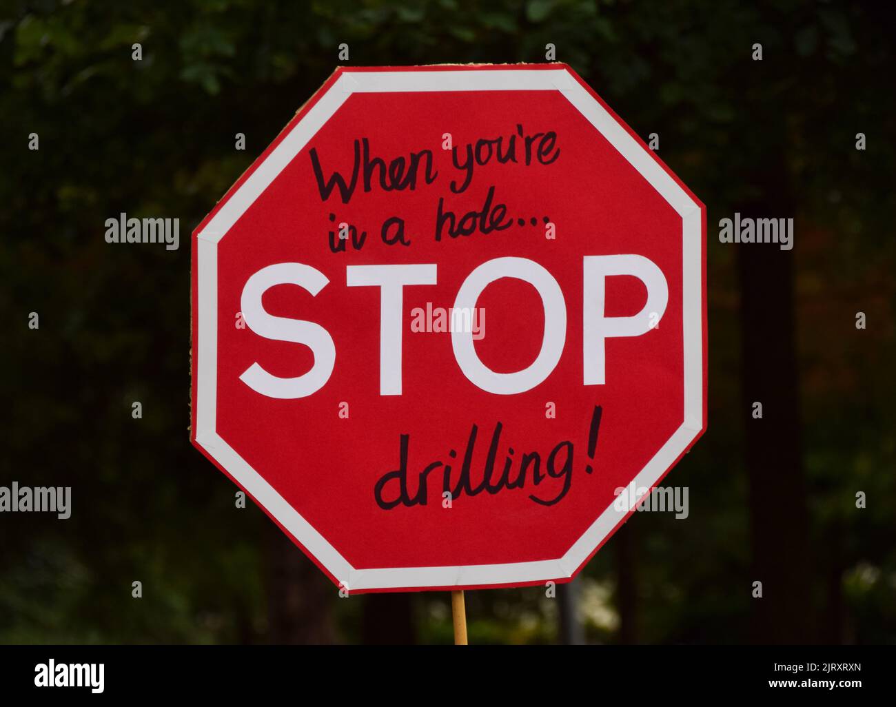 A placard in the shape of a Stop sign which states "When you're in a ...