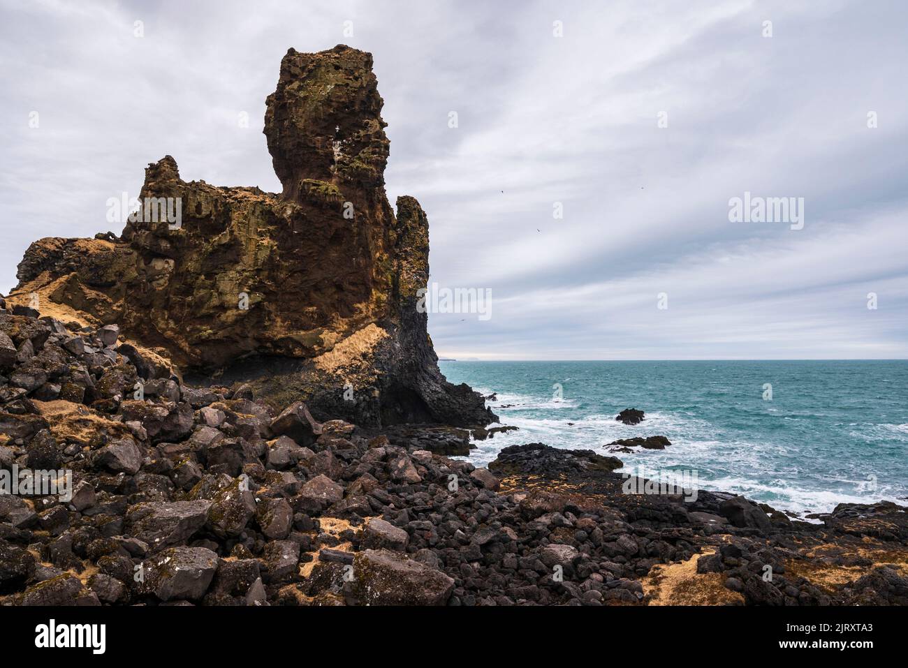 Coastal scenery at the impressive Lóndrangar basalt rock pinnacles on ...