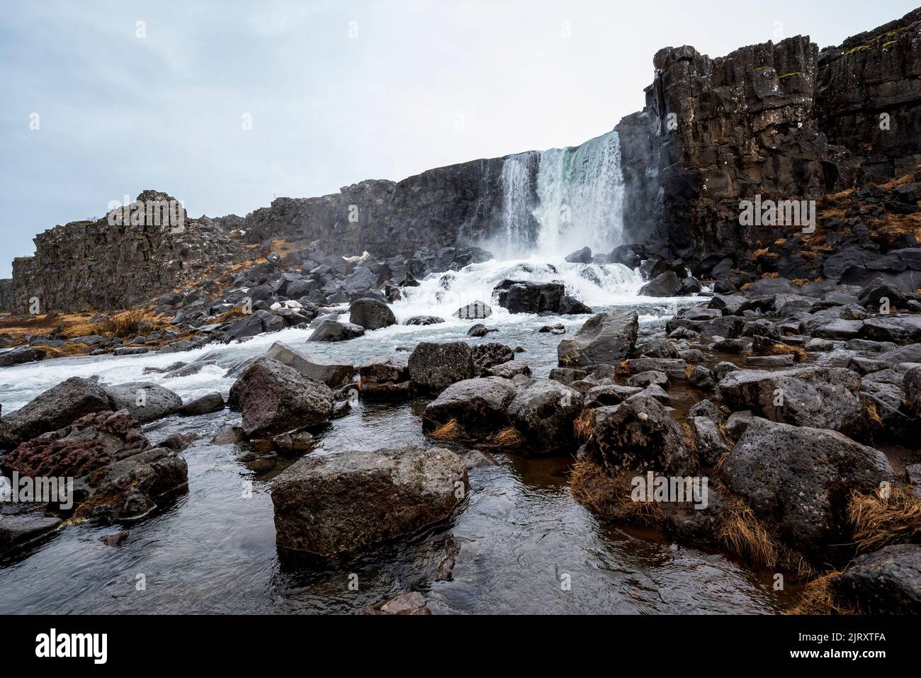 The beautiful Öxarárfoss waterfall flows from the river Öxará over ...