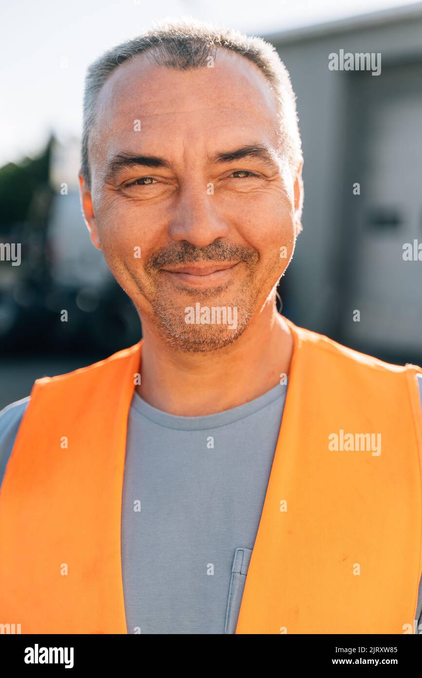 Portrait of caucasian mature man on semi-truck vehicles parking ...