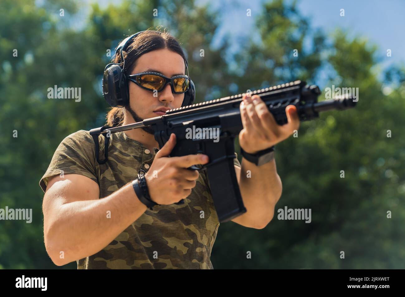 Closeup portrait of a masculine muscular military-like black-haired ...