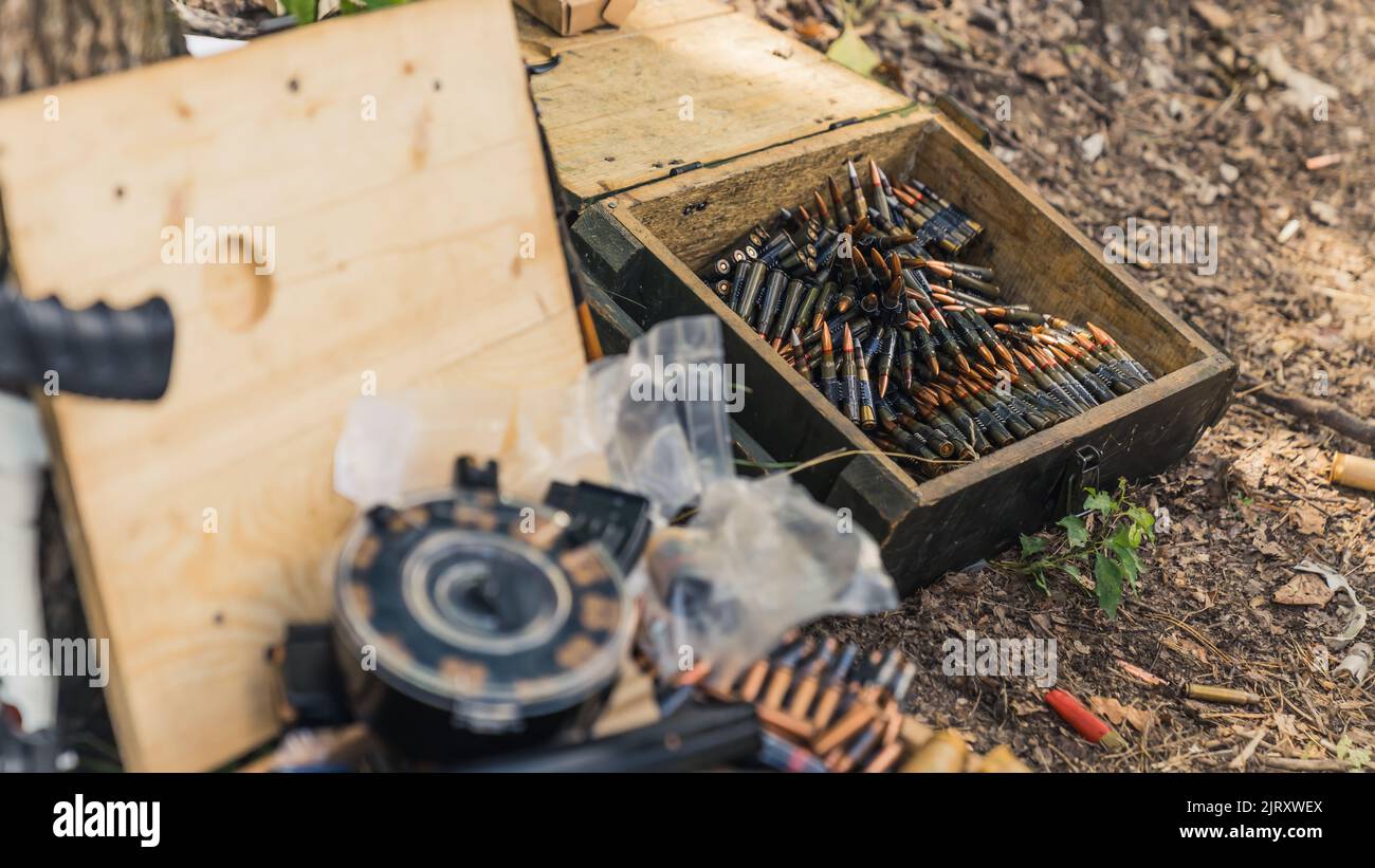 Outdoor shot focused on the background where is big wooden box full of ...