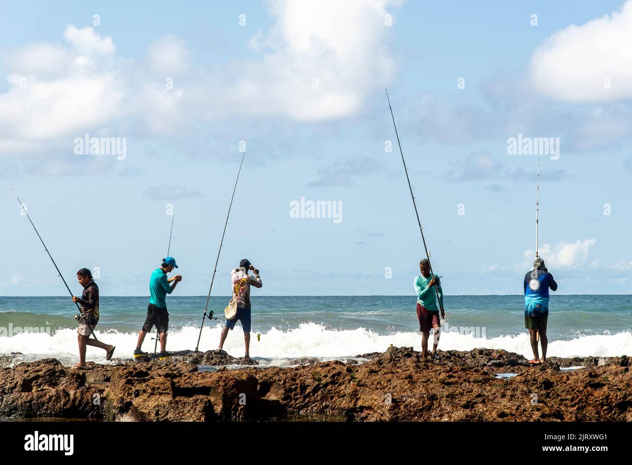 Fishermen with fishing rod on the rocks fishing on the famous Boca do ...