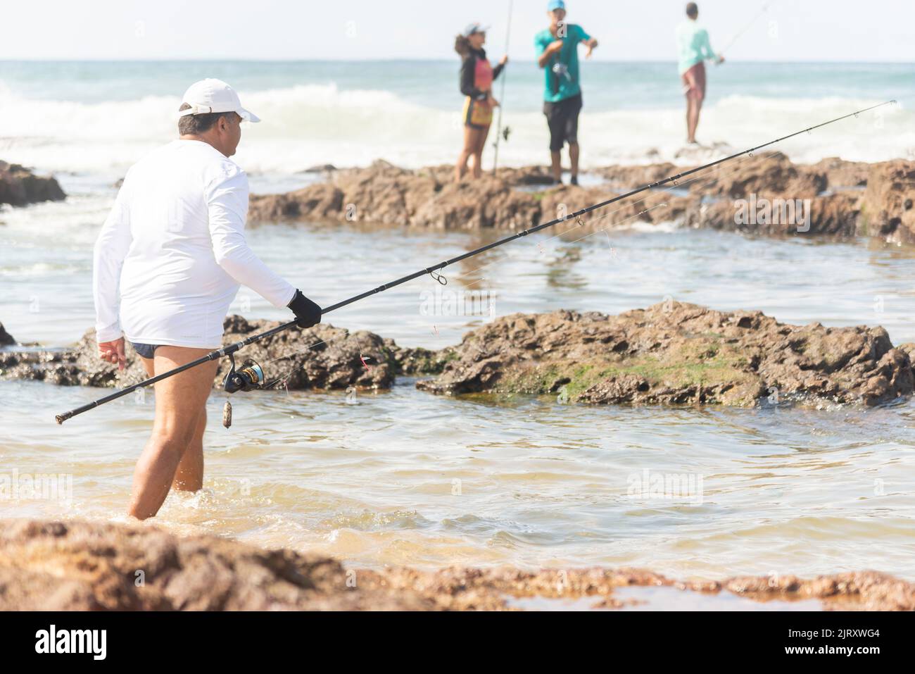 Fishermen with fishing rod on the rocks fishing on the famous Boca do ...