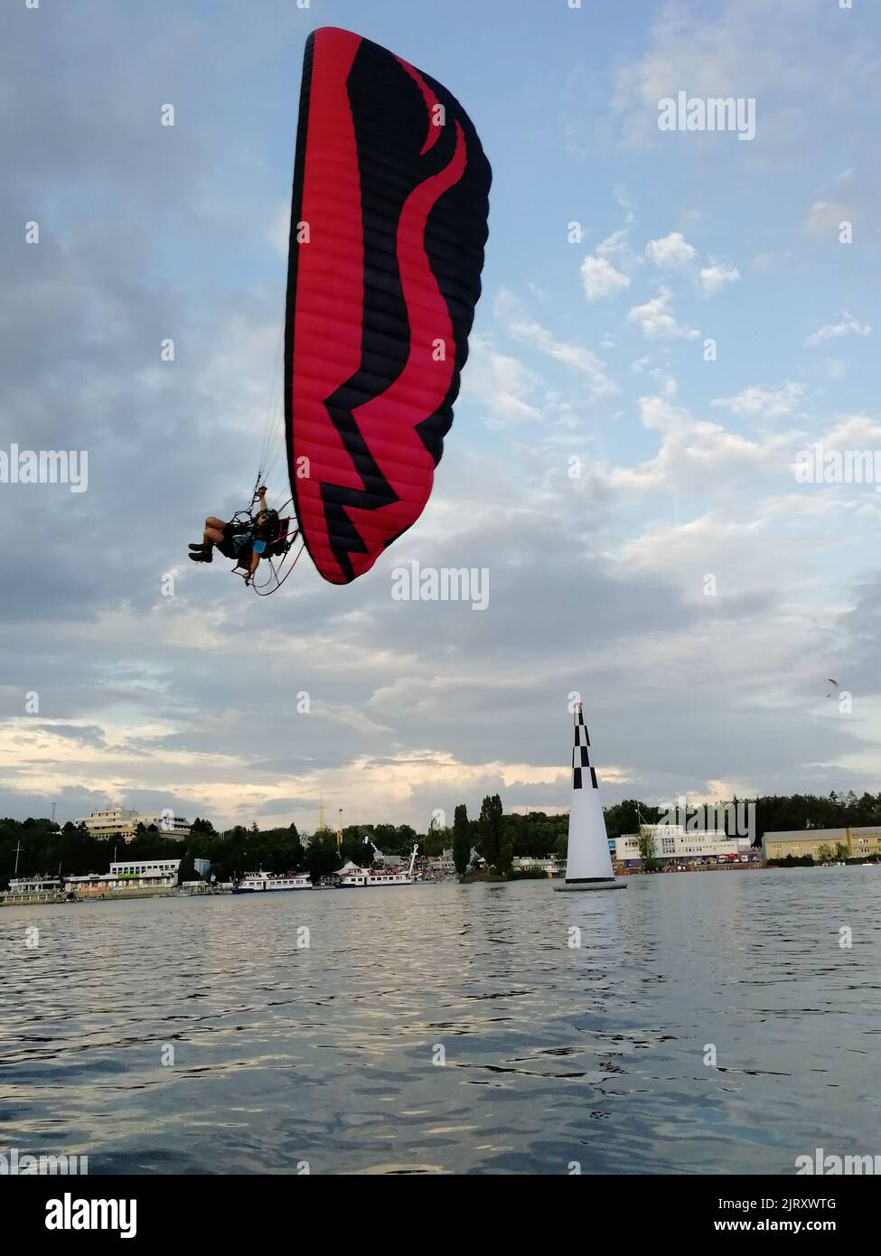 paragliding pilot flying in smooth air on colorfum paraglider wings in mountains,beauty of free ...