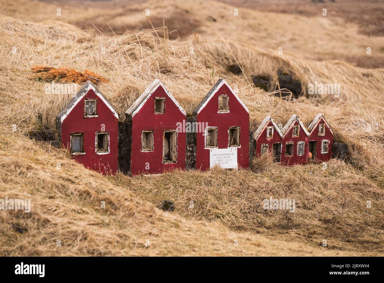 Full frame shot of the tiny red wooden house in the grass near ...
