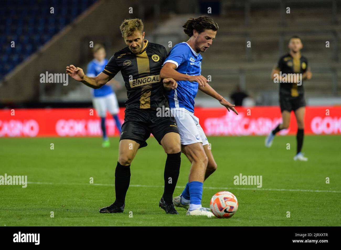 Lommel's Robin Henkens and Jong Genk's Jay-Dee Geusens pictured during ...
