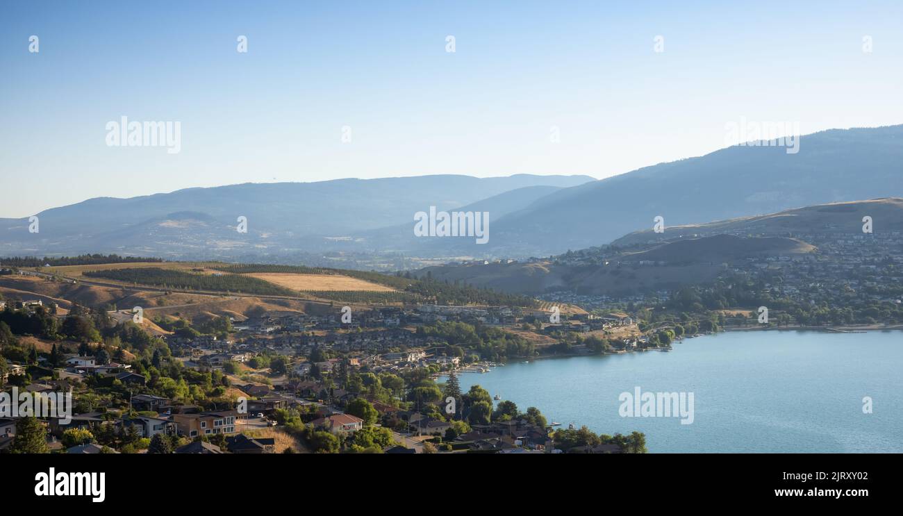Scenic View of Kalamalka Lake and a small City during sunny summer ...