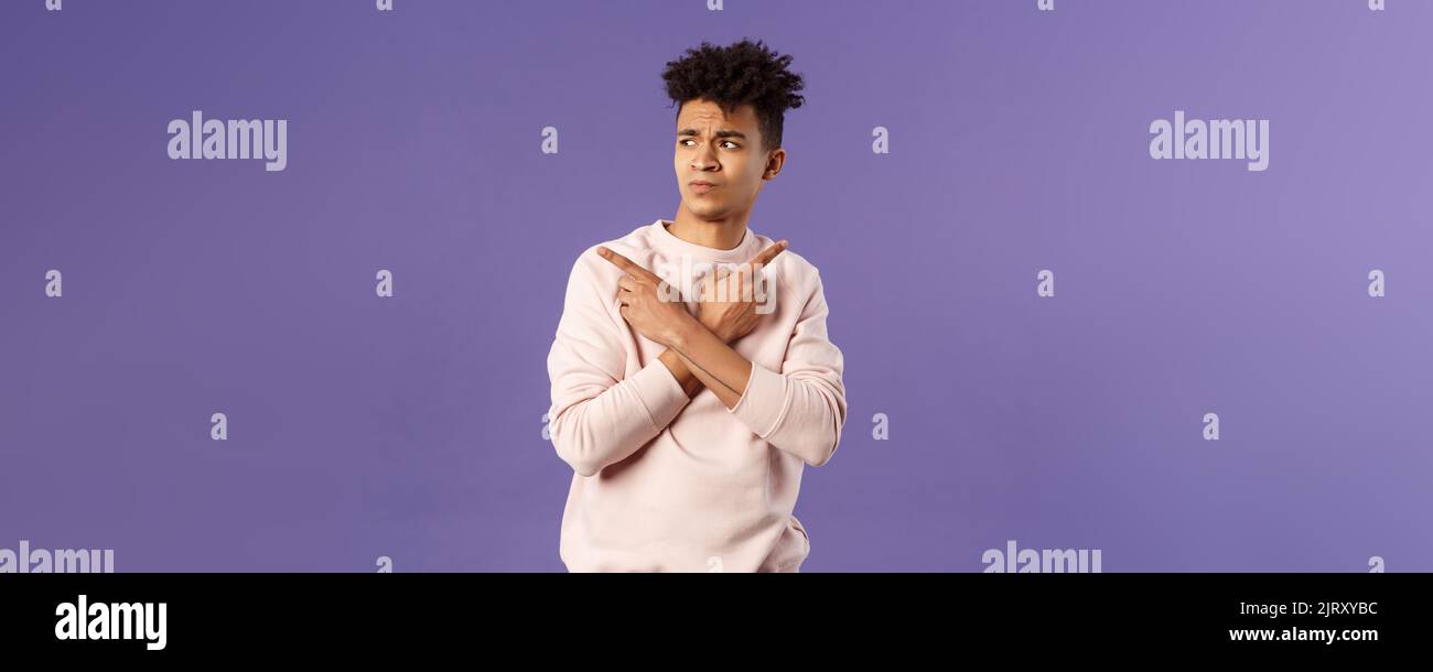 Portrait of troubled, indecisive handsome young man facing difficult ...