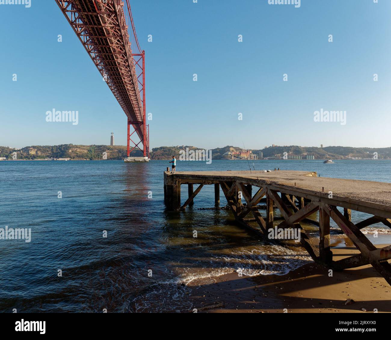 The Ponte 25 de Abril (25th of April Bridge) spanning the river Tagus ...