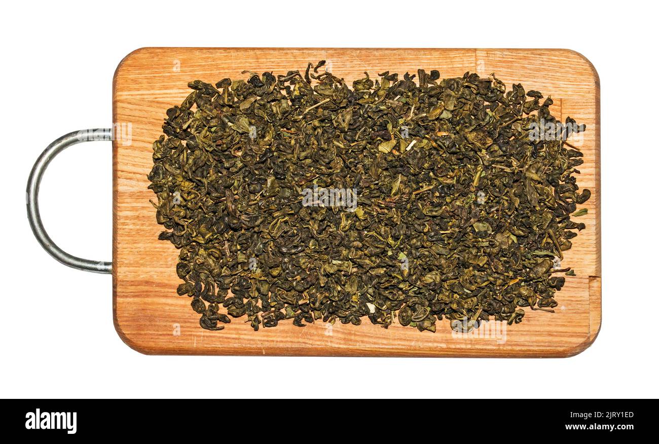 Organic green tea with dried lime. Mix on a wooden kitchen board ...