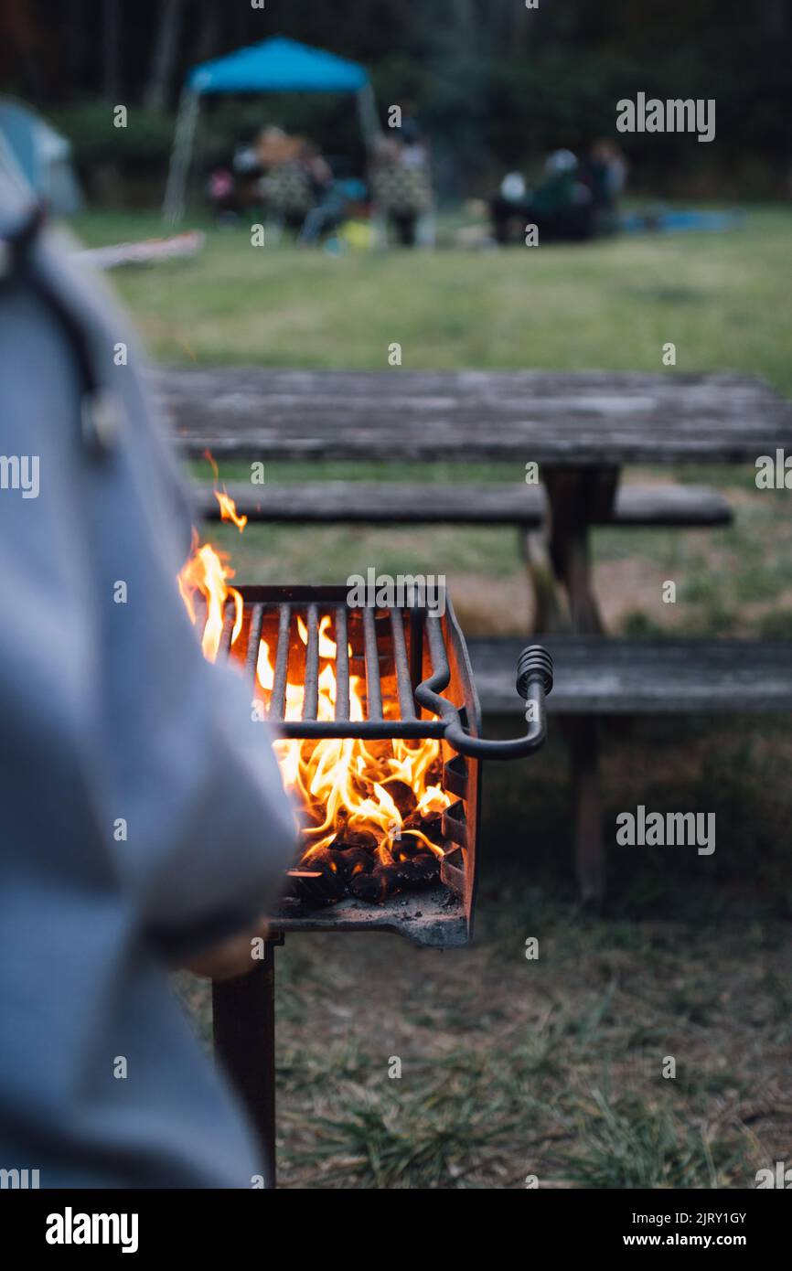 outdoor bbq grill with fire flames at picnic campsite Stock Photo - Alamy